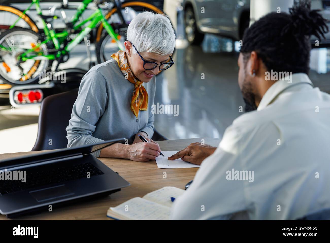 Car salesman explaining financial hi-res stock photography and images ...