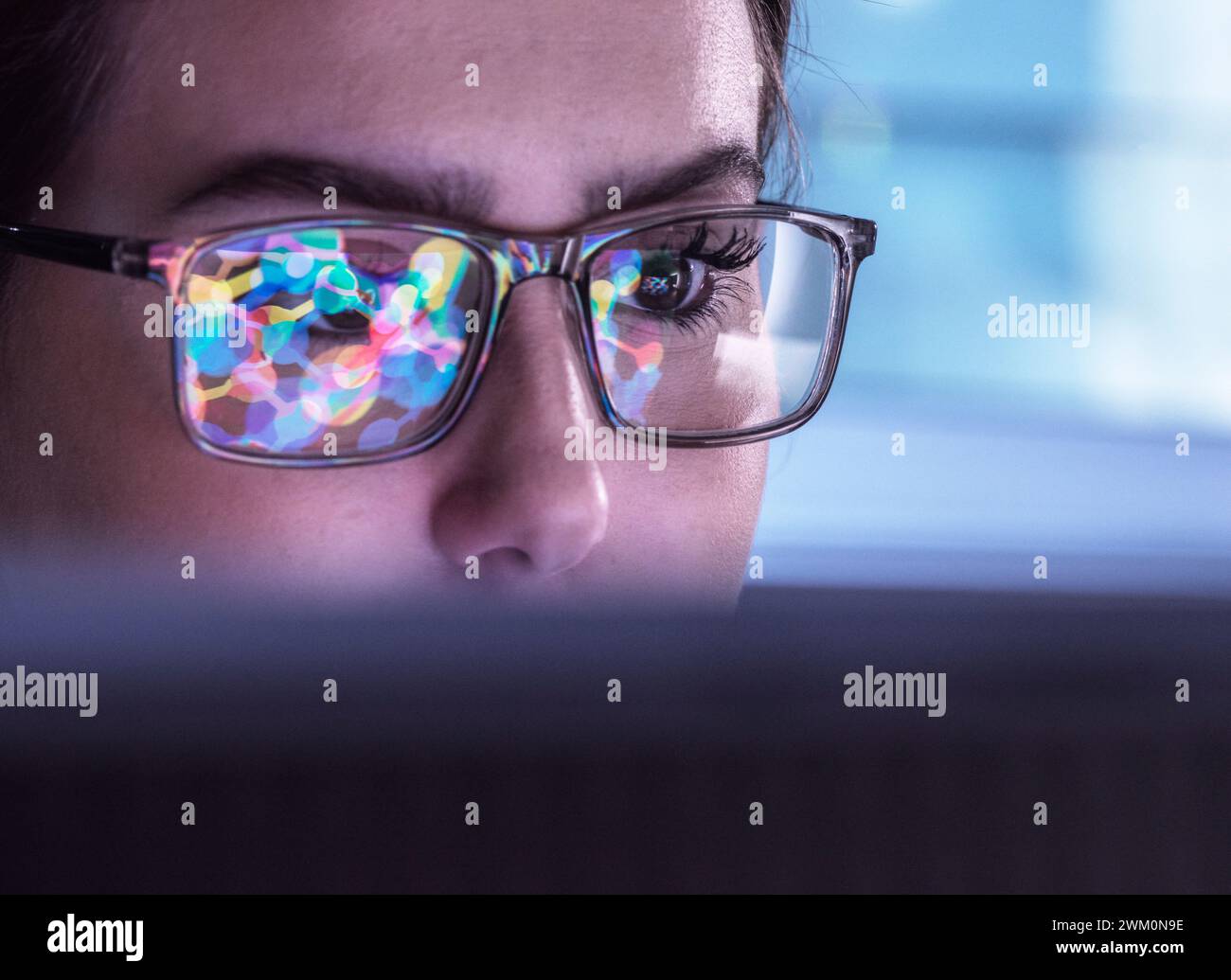 Scientist wearing eyeglasses and analyzing biochemical data on computer Stock Photo - Alamy