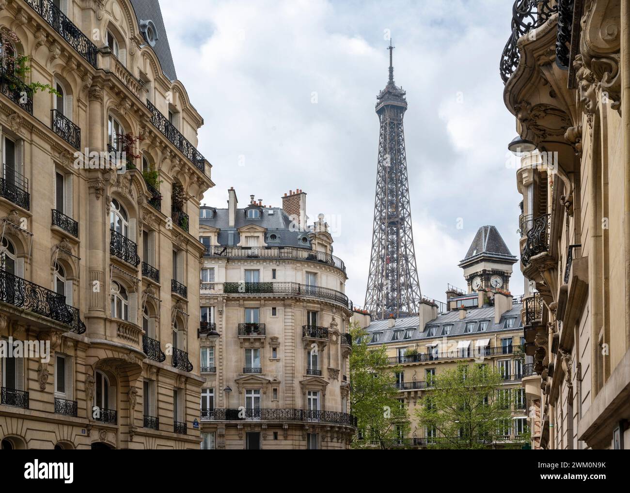 Eiffel Tower behind residential buildings in Paris, France Stock Photo ...
