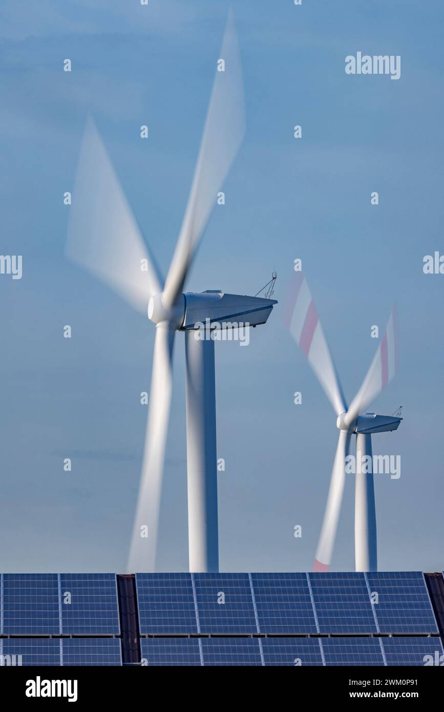 Solar panels and spinning wind turbines Stock Photo - Alamy