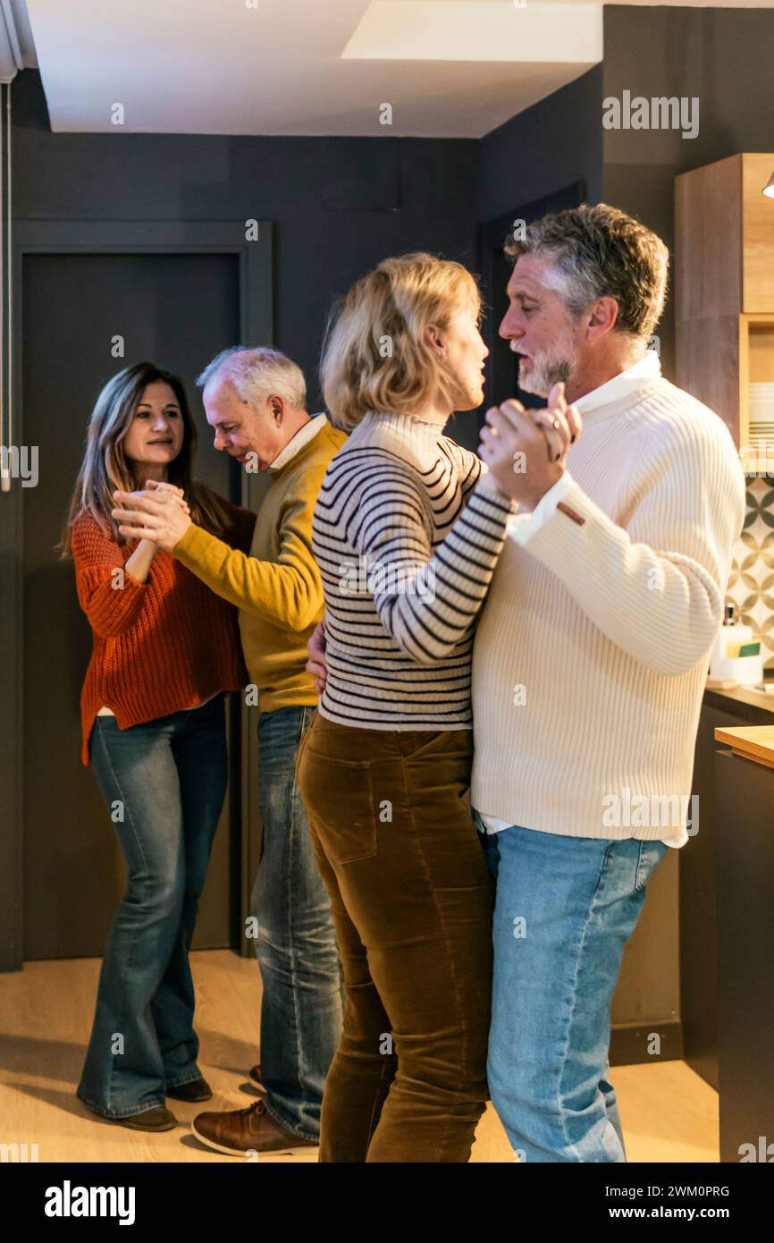 Happy couple together dancing at retirement party in home Stock Photo ...