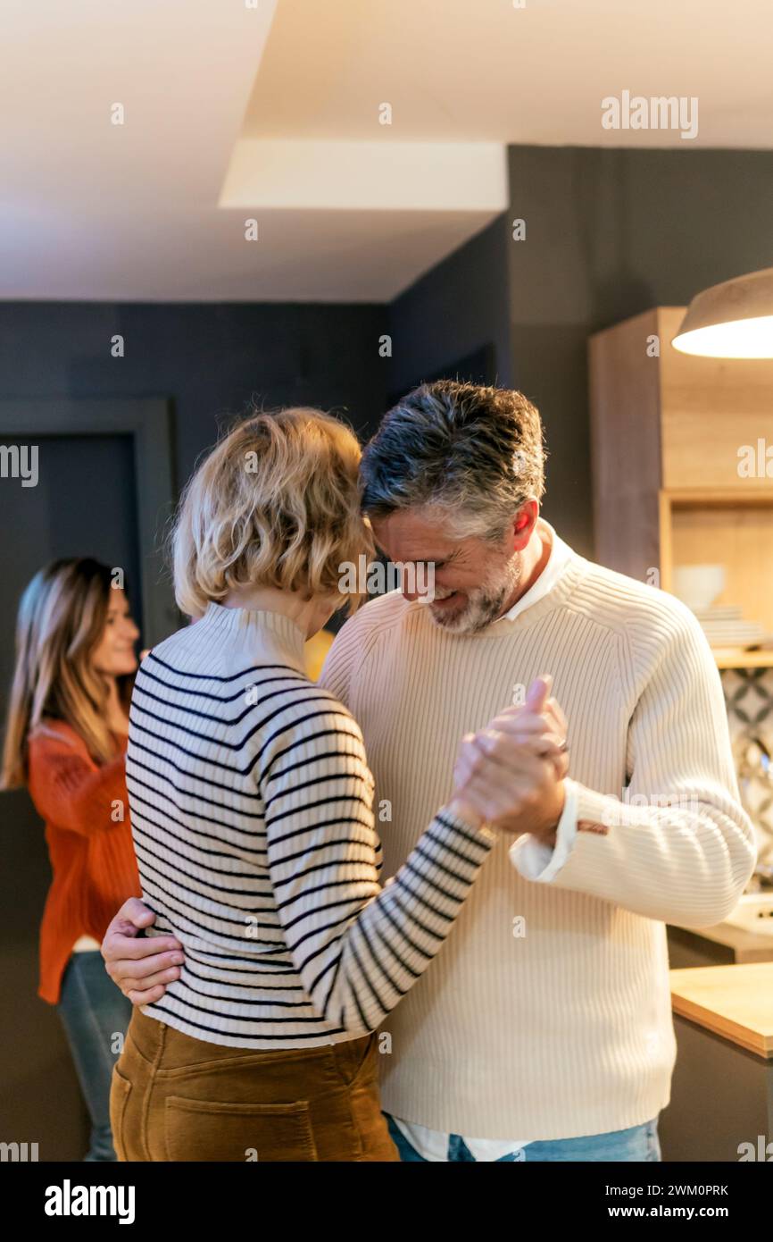 Happy couple together dancing at retirement party Stock Photo - Alamy