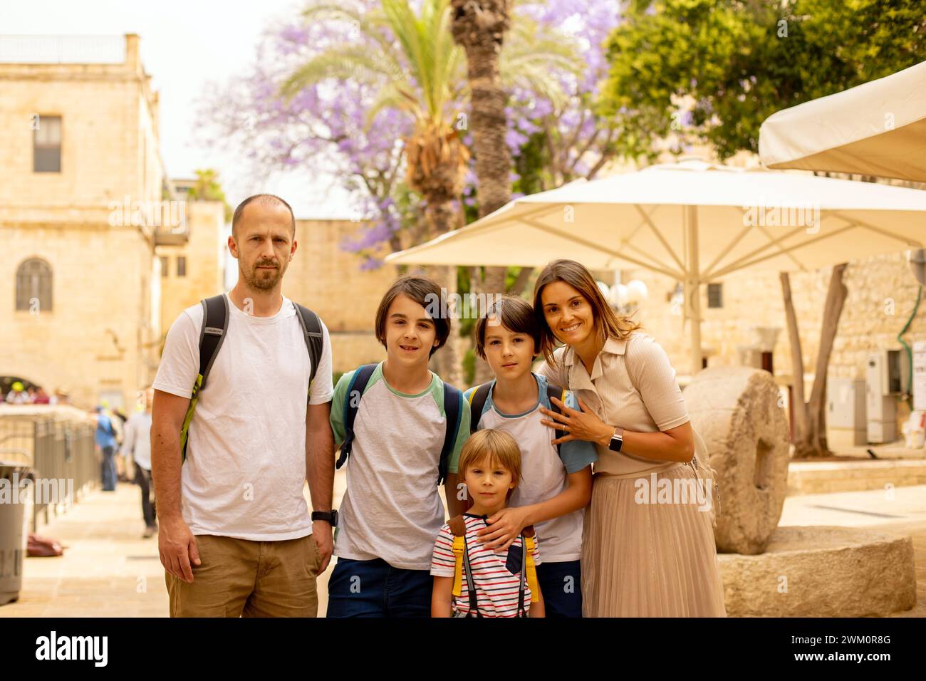 European tourist family with children, visiting Jerusalem, meeting new ...