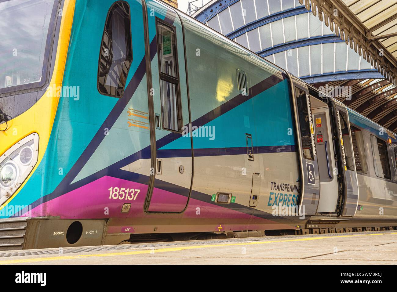 Low angled view of a train at a railway station platform waiting to ...