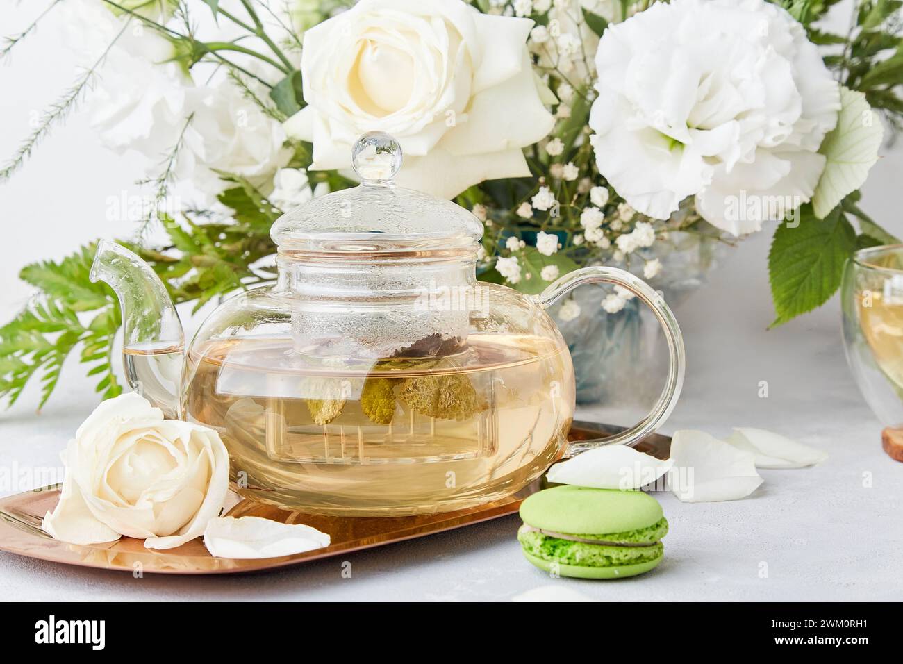 Aesthetic morning table setting. Green tea, macaroon desserts, white ...