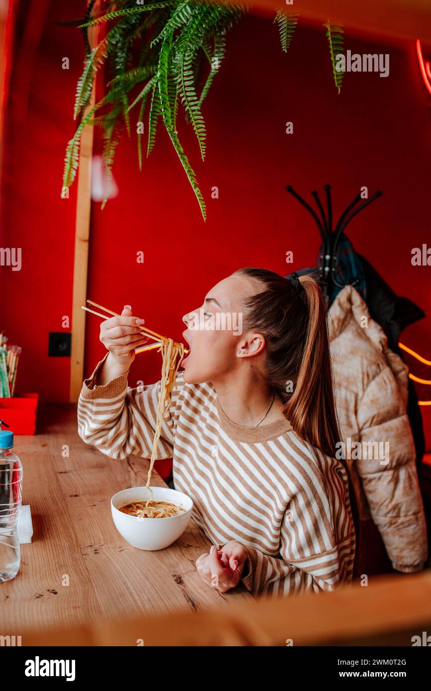 Eating ramen open mouth hi-res stock photography and images - Alamy