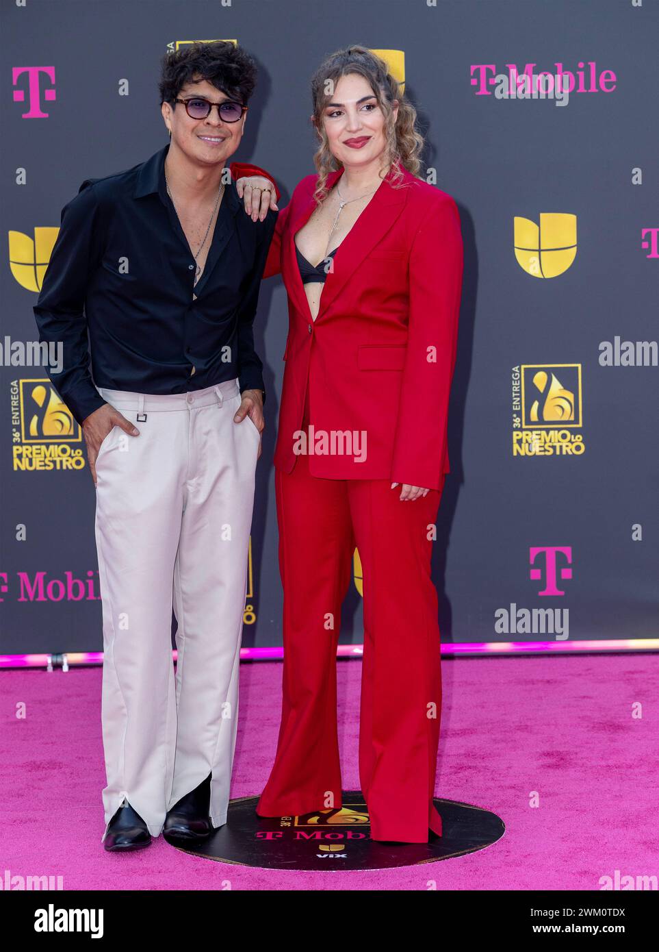 Miami, United States. 22nd Feb, 2024. Periko and Jessi Leon walk the ...