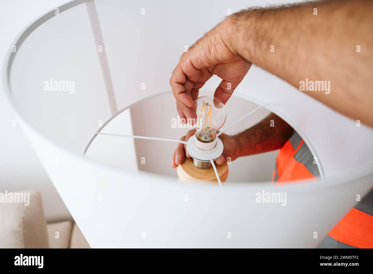 Changing lightbulb hand lamp hi-res stock photography and images - Alamy