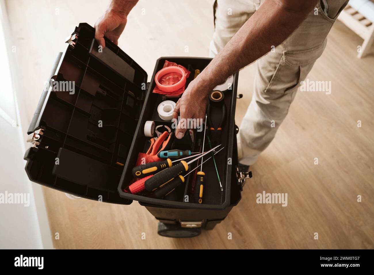 Male picking up box from hi-res stock photography and images - Alamy