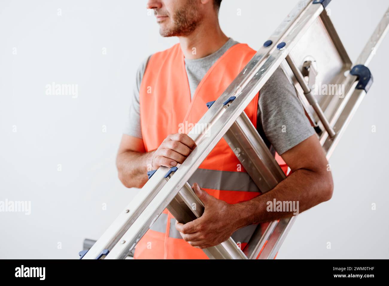 Man carrying ladder hi-res stock photography and images - Alamy