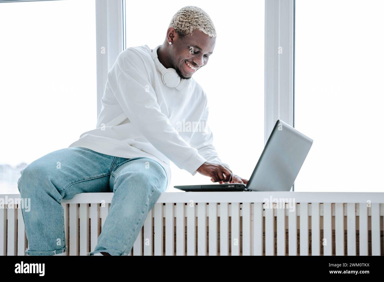 African american freelancer using hi-res stock photography and images ...