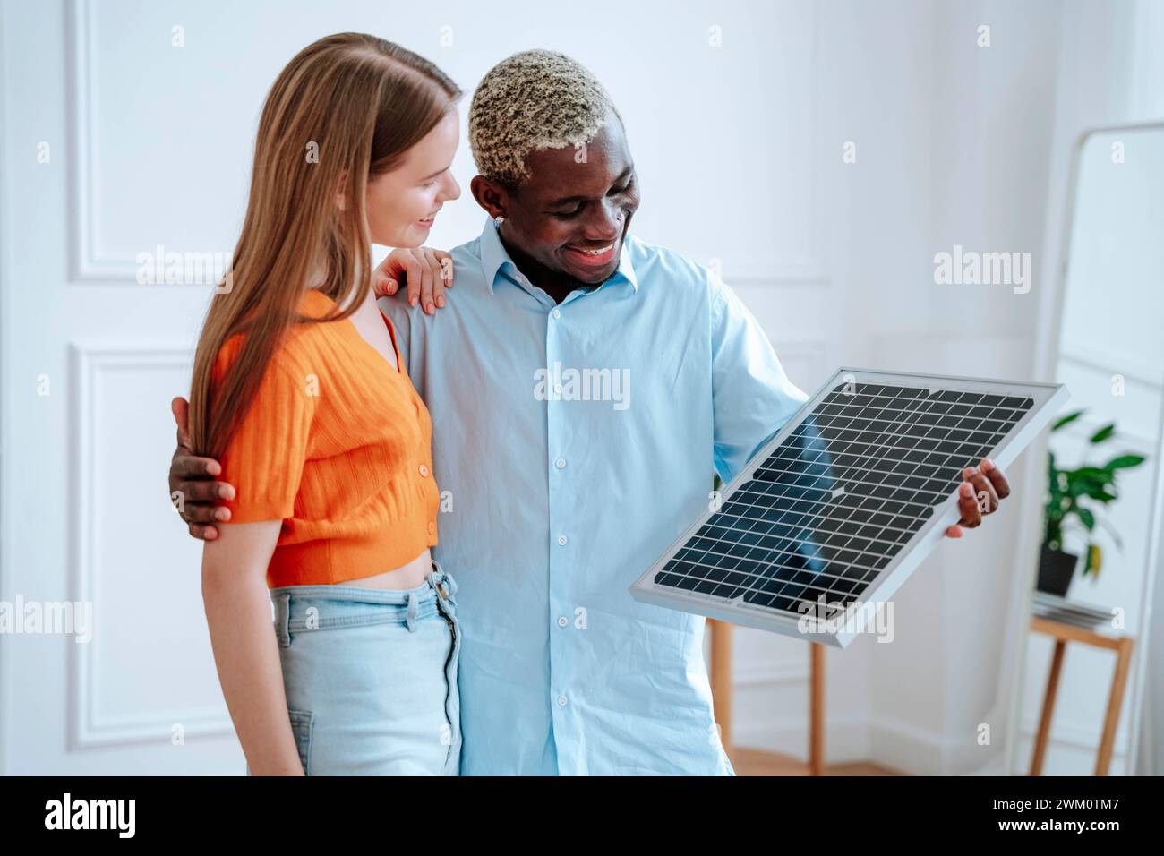 African man holding solar panel hi-res stock photography and images - Alamy