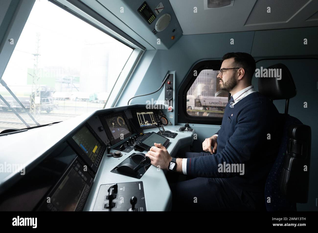Pirna, Germany. 22nd Feb, 2024. Philipp Schulz, train driver, arrives at Pirna station in a ...