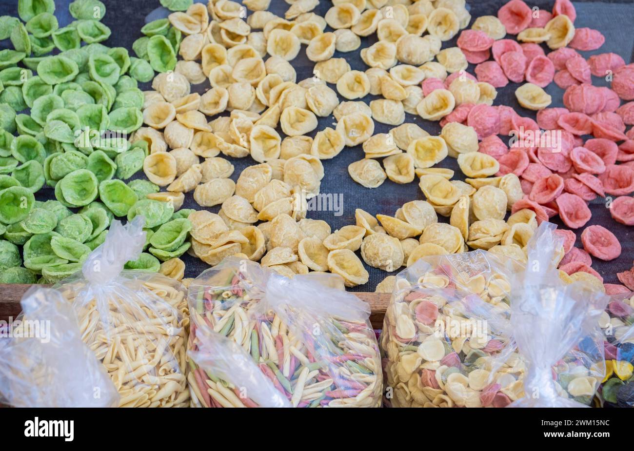 Close up on fresh raw orecchiette, typical apulian pasta, in downtown ...