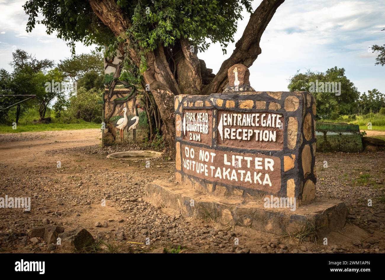 A stone built sign at the entrance to Mikumi National Park in Tanzania ...