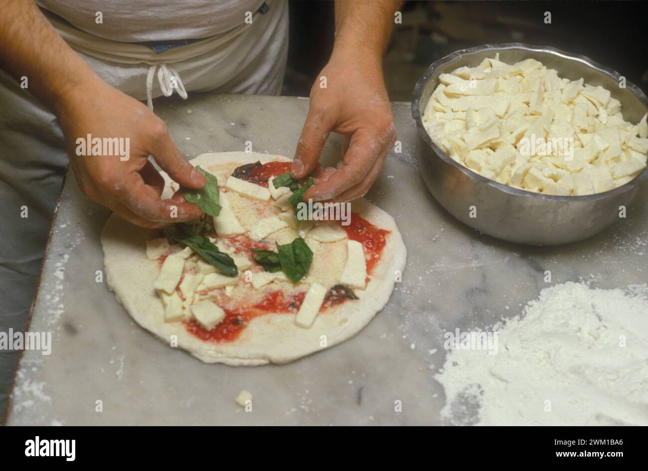 4066514 Naples, Italy. Preparation of Pizza Margherita at Brandi pizza ...