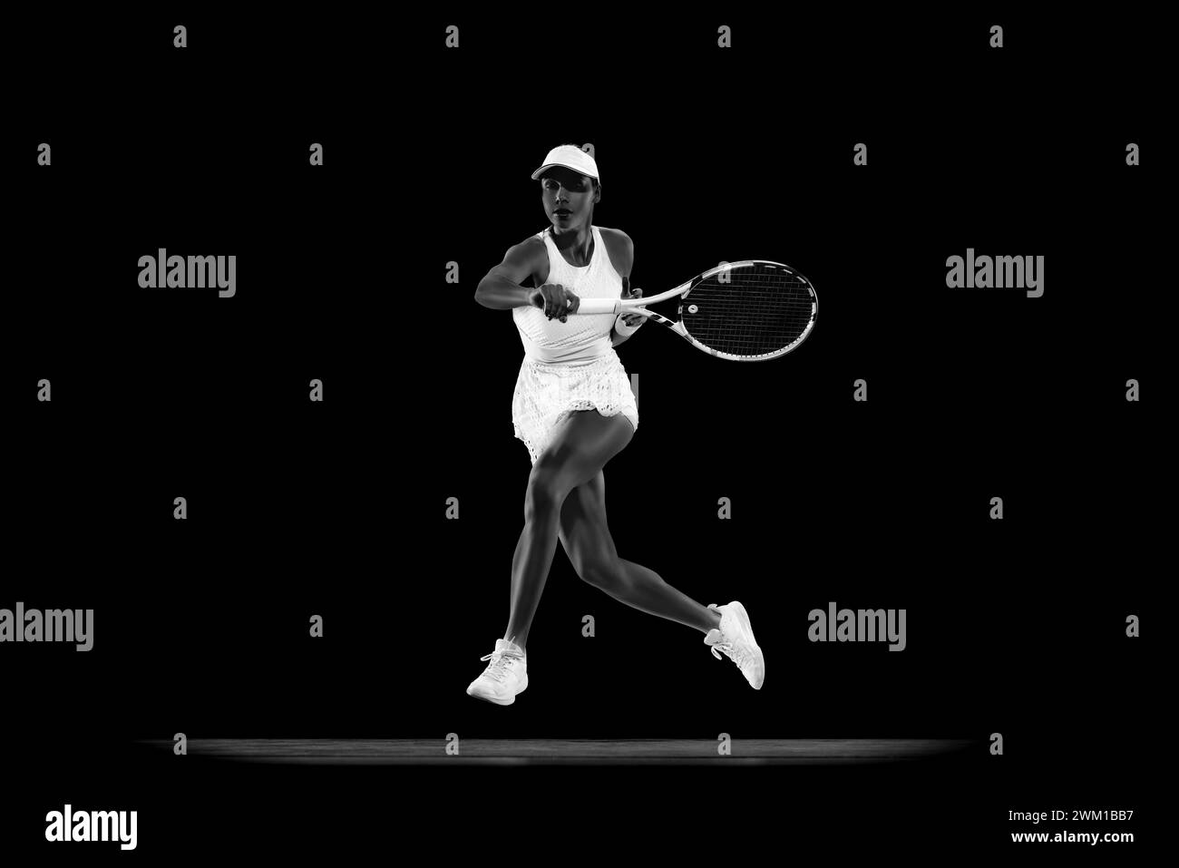 Dynamic photo of tennis player jumping to hit overhead shot in match ...