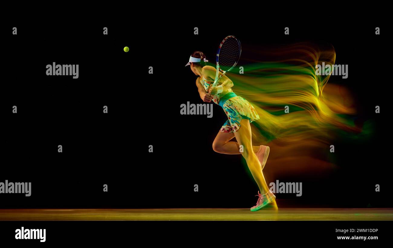 Dynamic photo of woman, tennis player leaping to hit overhead shot in ...