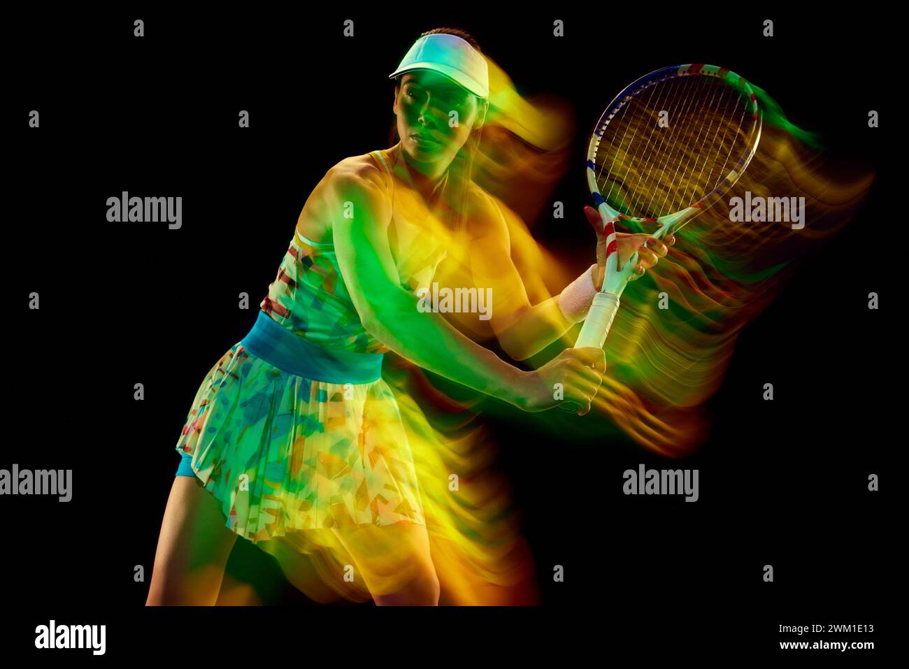 Sportive woman, tennis athlete playing backhand stroke against black ...