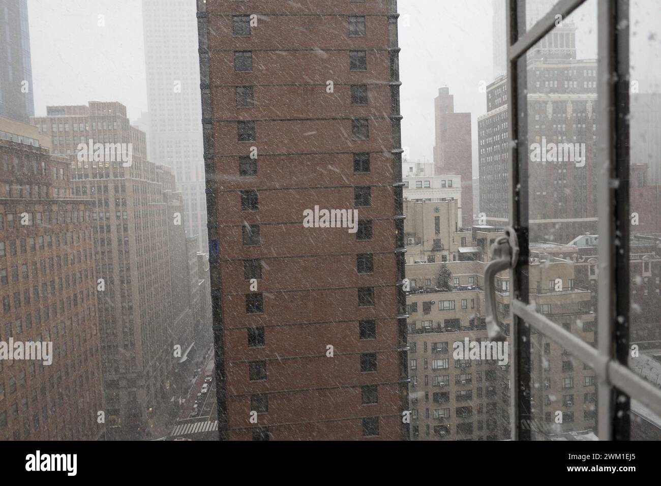 Snowfall through a casement window in an apartment in Murray Hill, 2024 ...