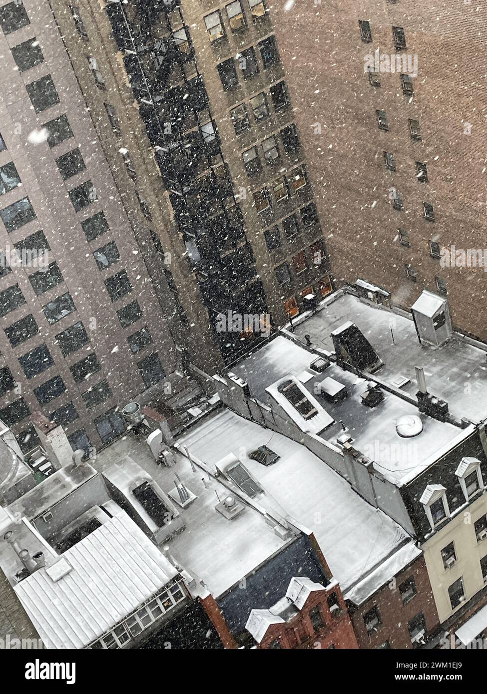 Snowfall through a casement window in an apartment in Murray Hill, 2024 ...