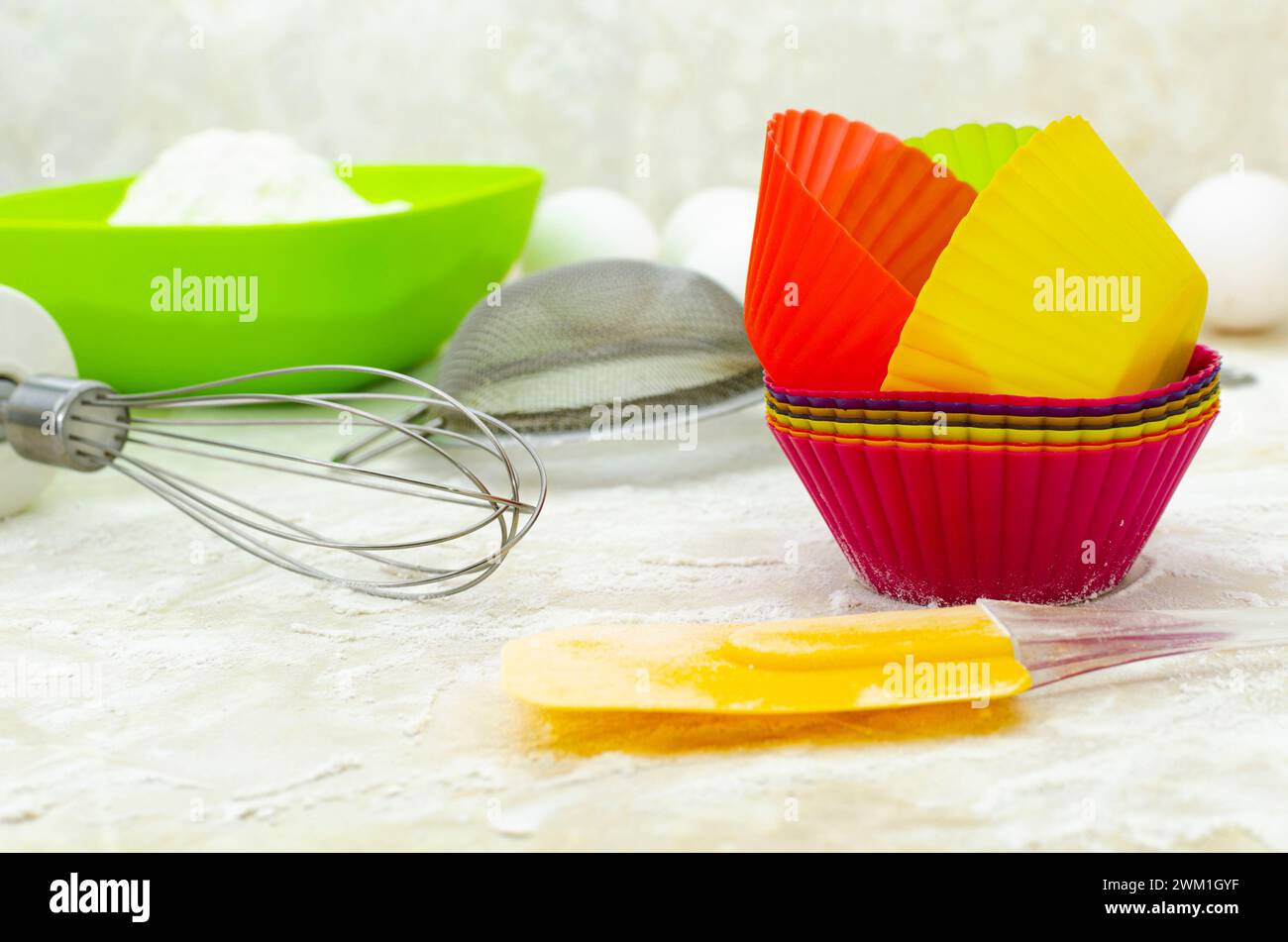 Close-up of cupcake molds on floured table, culinary utensils Stock ...