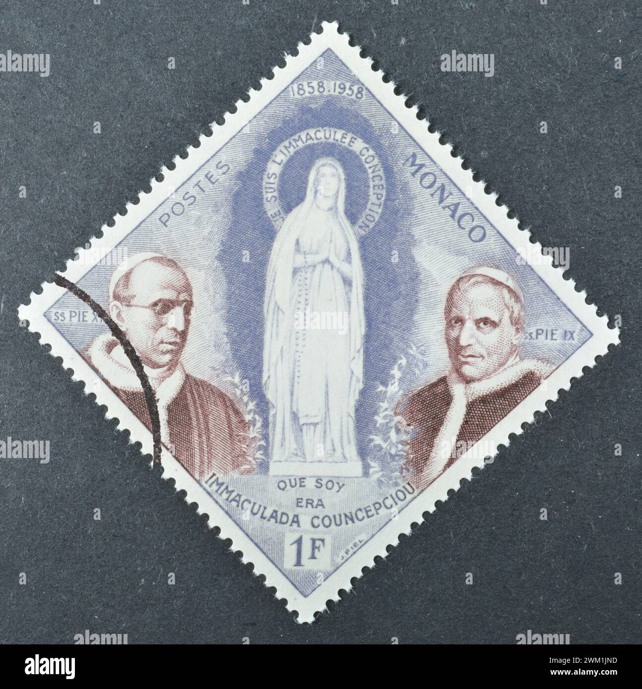 Cancelled postage stamp printed by Monaco, that shows Statue of Mary ...