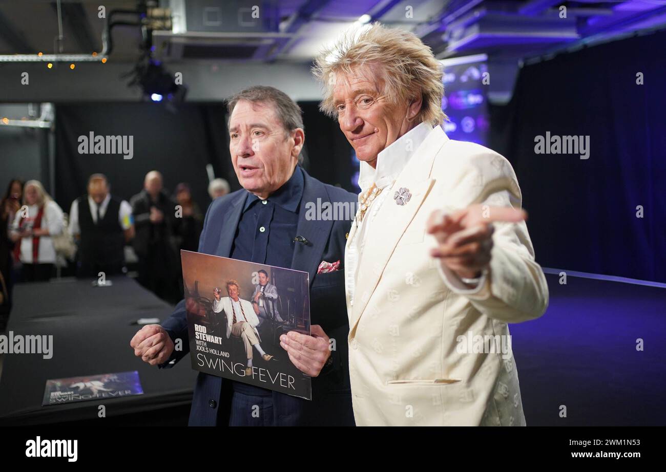 Jools Holland (left) and Rod Stewart during a signing session for their ...