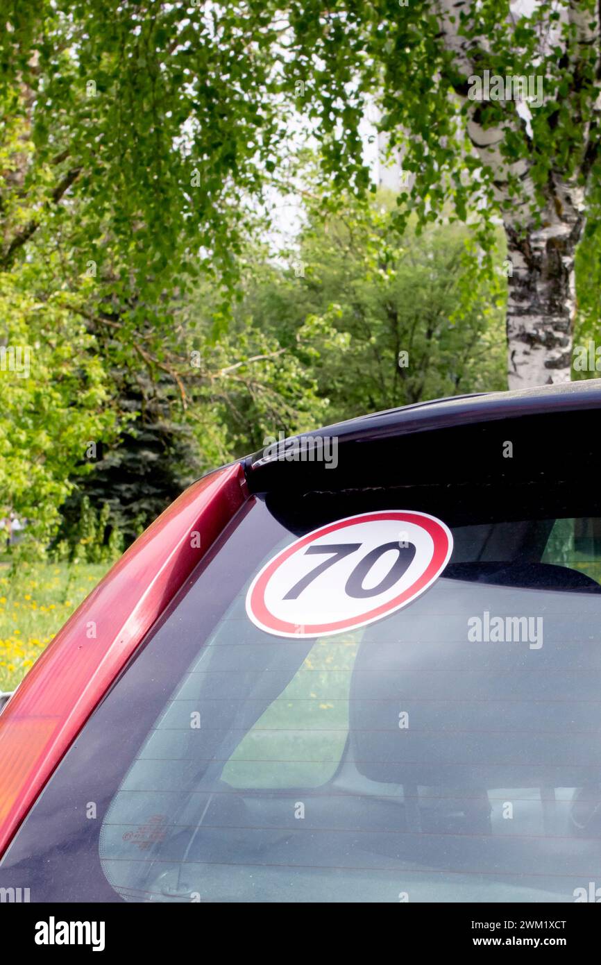 Sticker 70 on the rear window of the car close up Stock Photo - Alamy