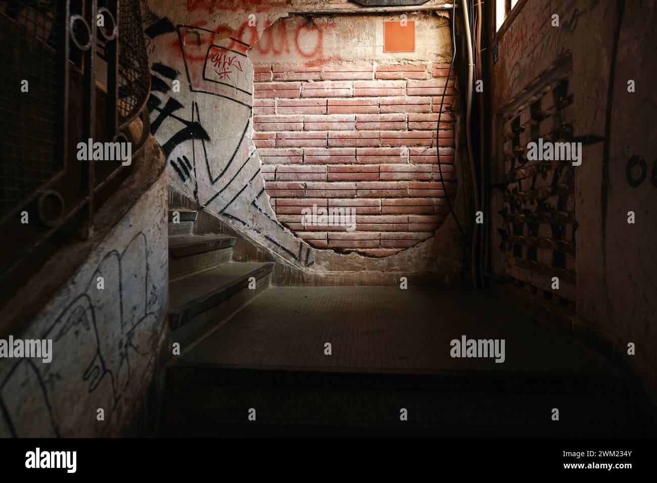 Brick wall under loose plaster in hallway of shabby building Stock ...