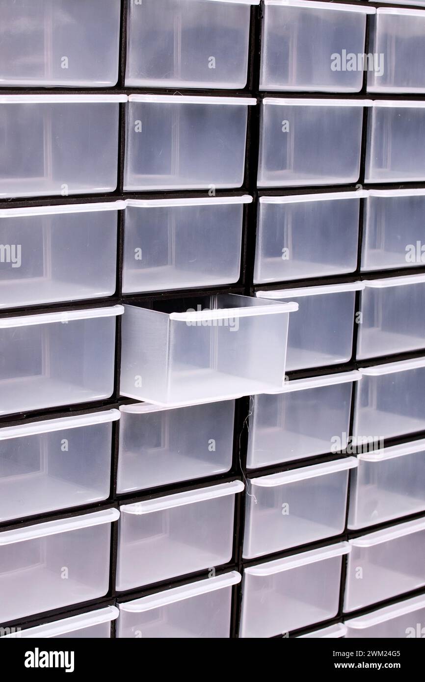 Plastic cells in the small change box close up Stock Photo - Alamy