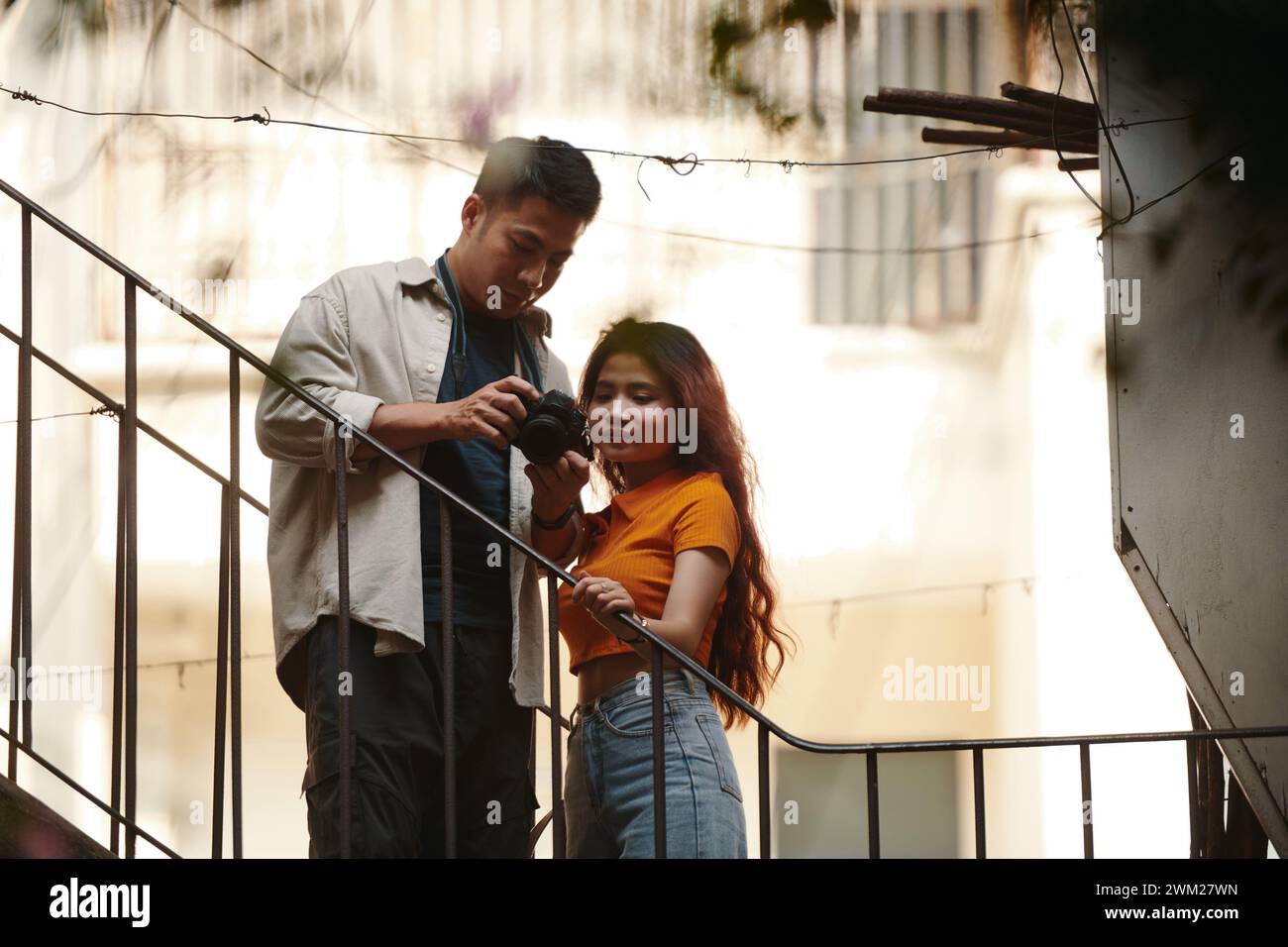 Photographer showing girlfriend camera screen with photos he made Stock ...