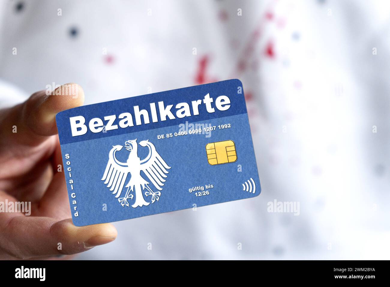 February 23, 2024: Payment card for refugees and migrants, A man holds ...