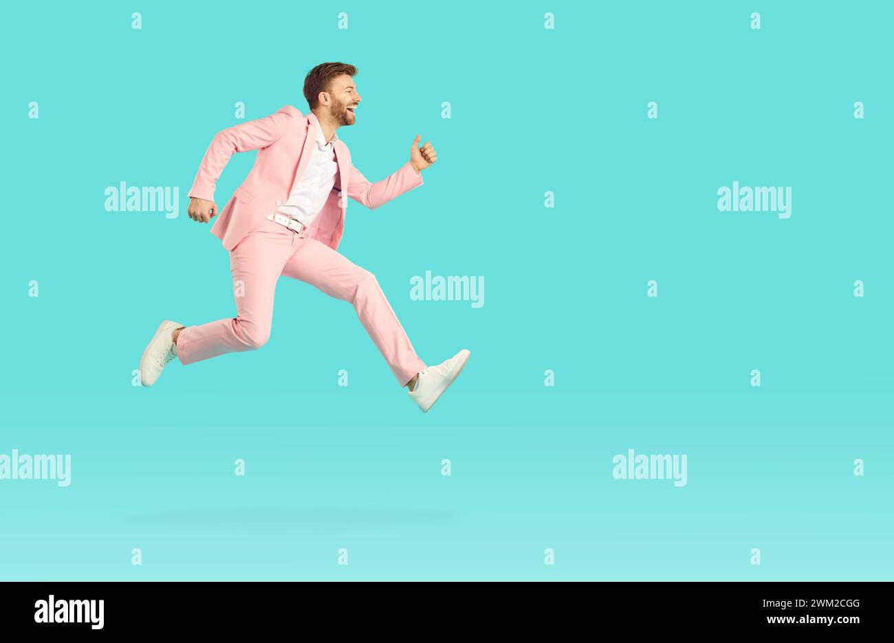 Happy man running, jumping and flying on a blue color advertising copy ...