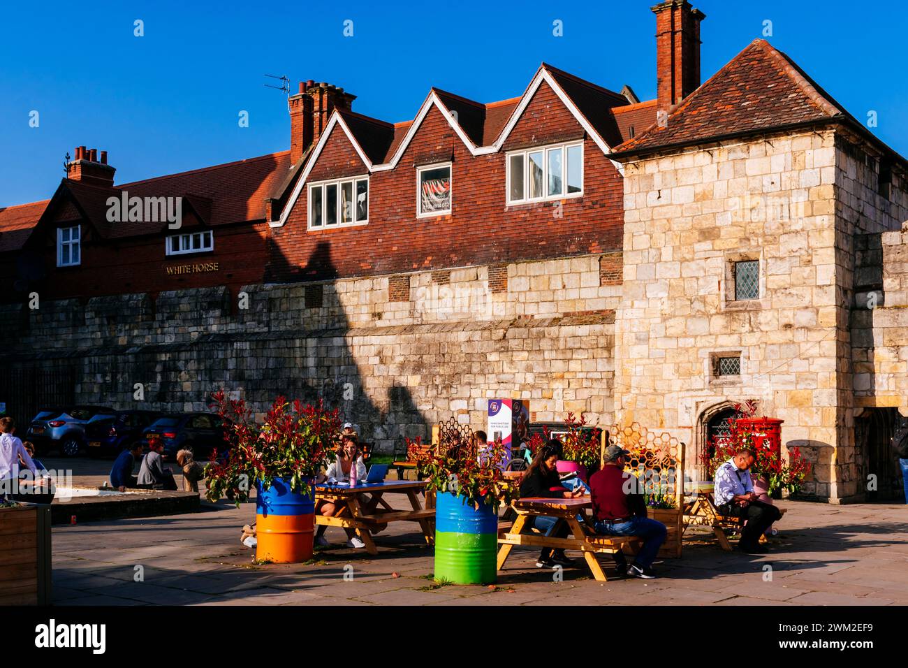 People resting at sunset in Exhibition Square. York, North Yorkshire ...