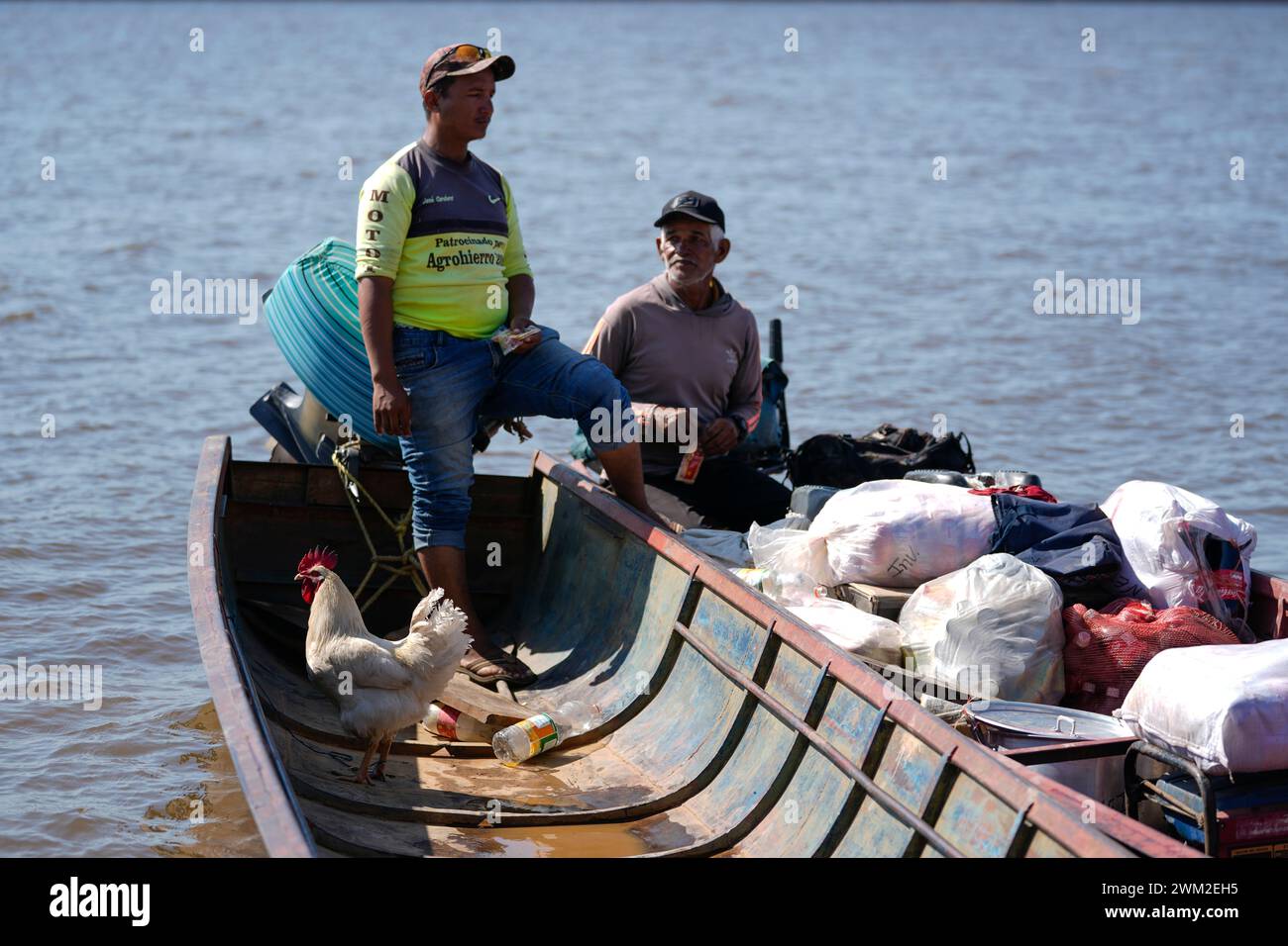 Boat man stand after they brought people from the Bulla Loca mine ...