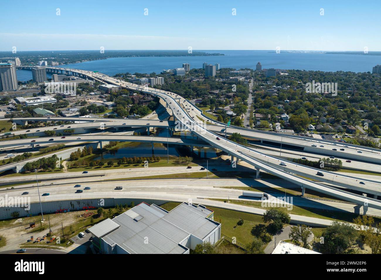 Aerial view of freeway overpass junction with fast moving traffic cars ...