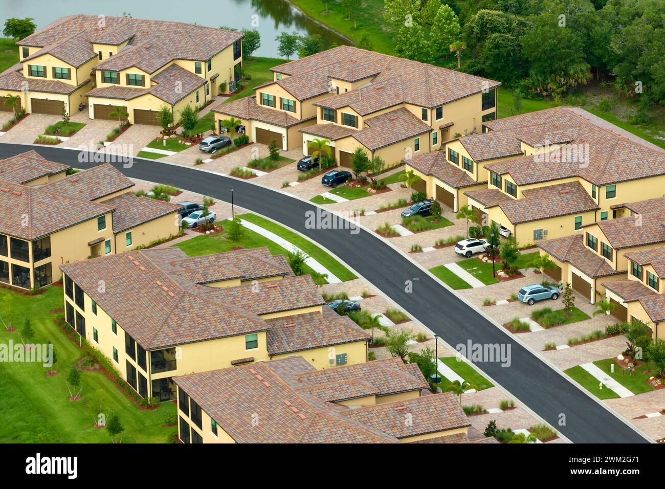 Aerial view of tightly located family houses in Florida closed suburban ...