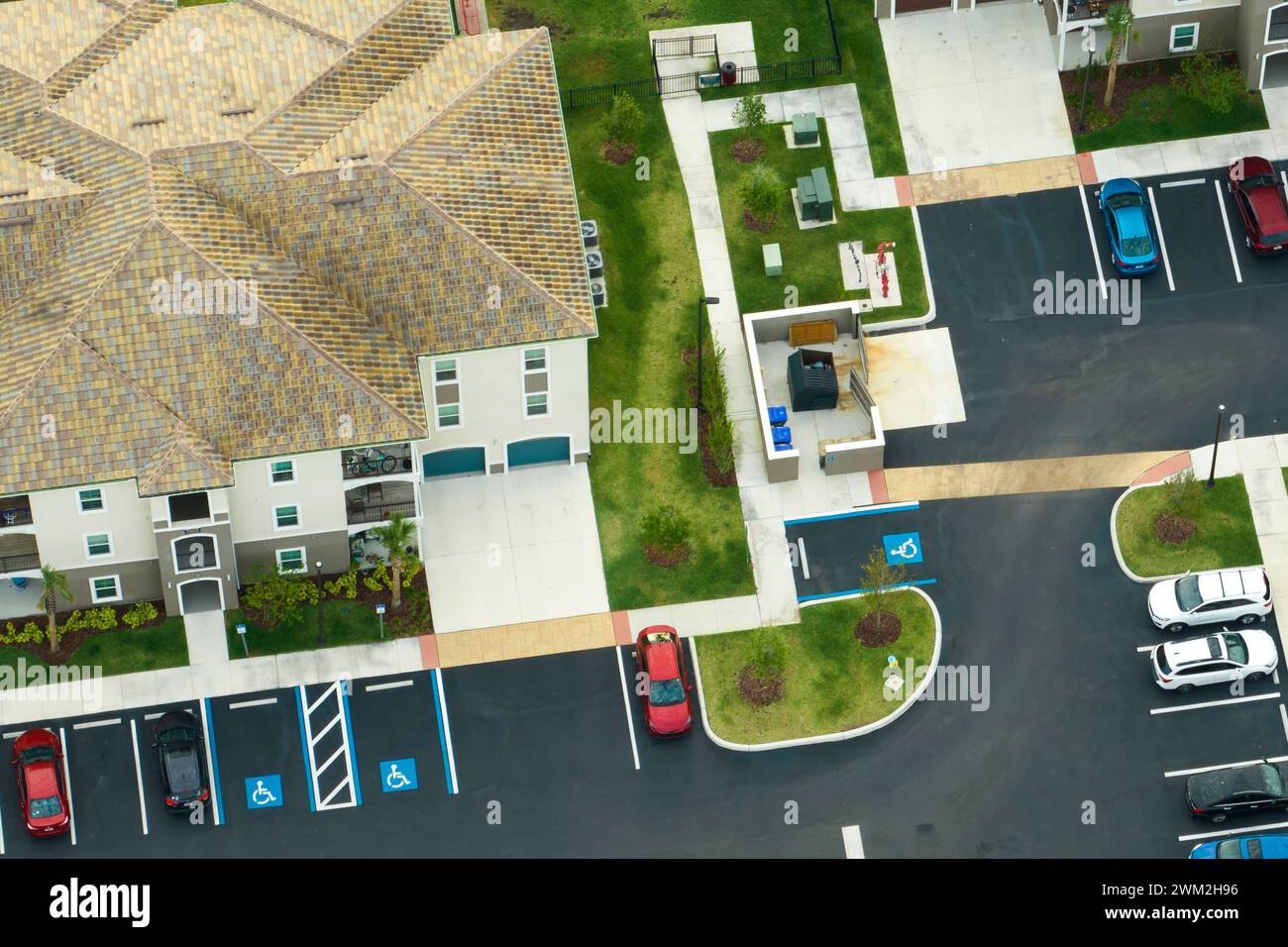 Cars parked on parking place of new apartment condos in Florida ...