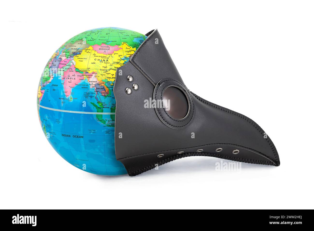 Earth Globe with the plague mask showing Asia: epidemic concept. The ...