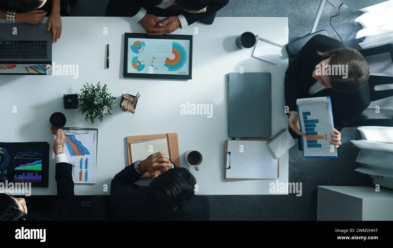 Top view of smart executive manager holding stock market investment ...