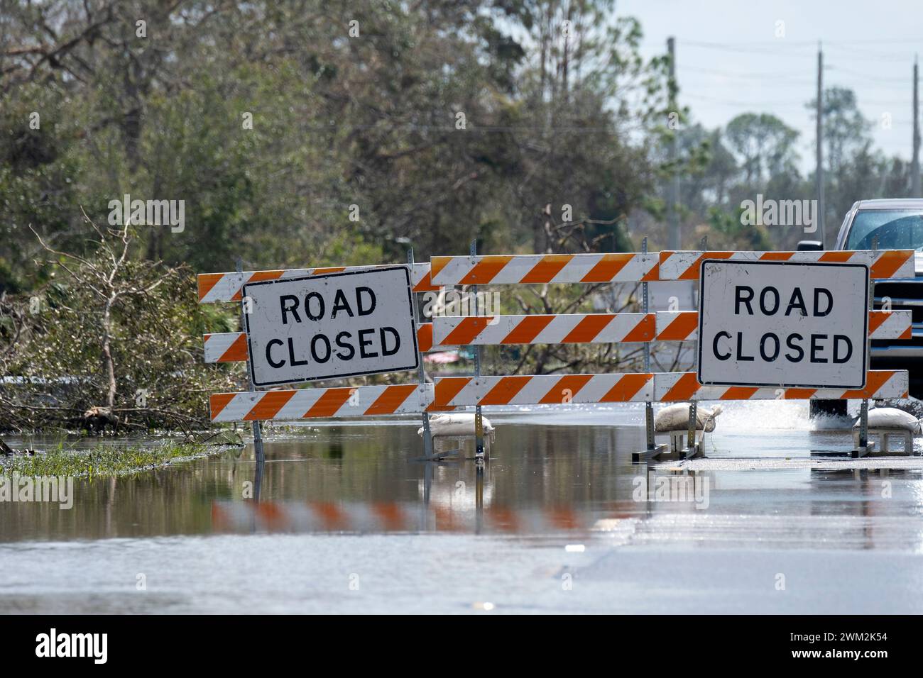 Flooded street in Florida after hurricane rainfall with road closed ...