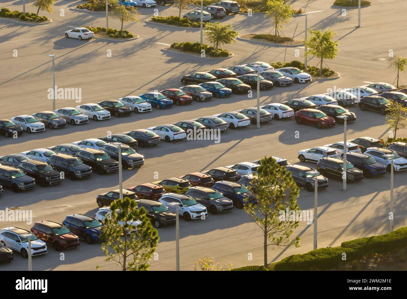 Large parking lot of local dealer with many brand new cars parked for ...