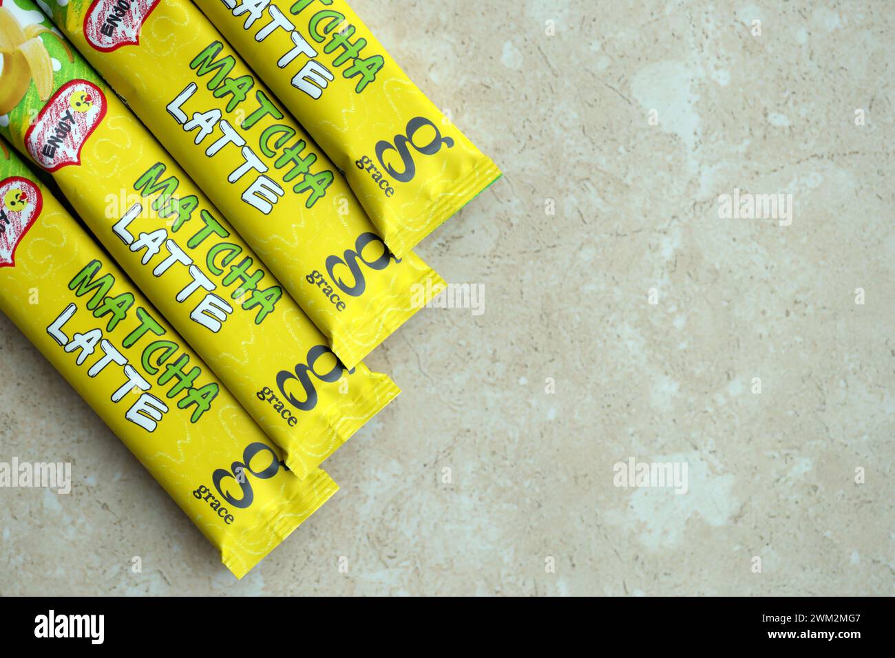 KYIV, UKRAINE - OCTOBER 31, 2023 Matcha Latte yellow sticks of green ...