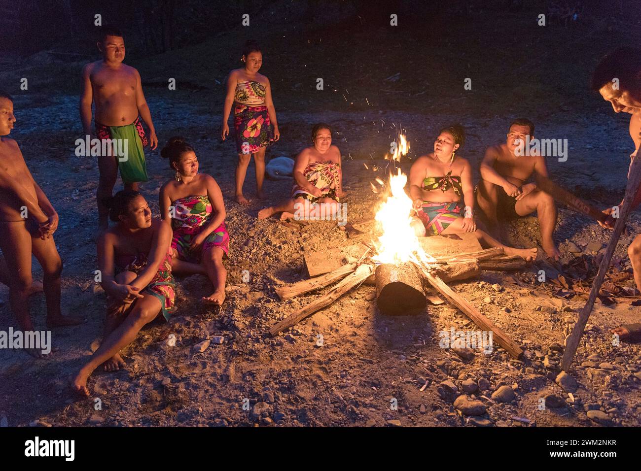 Women and men from Embera tribe in their traditional clothes sitting ...