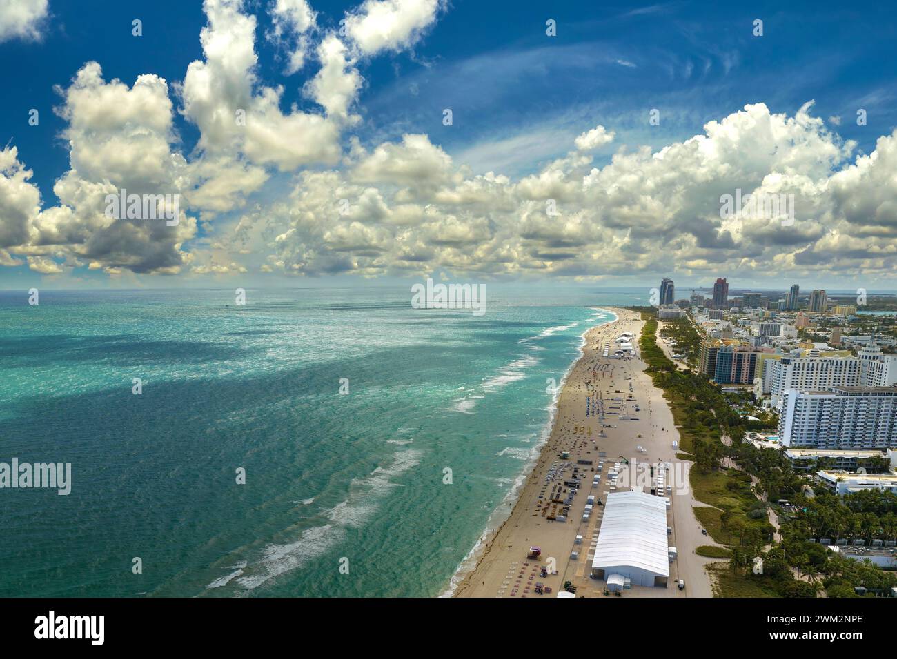 South Beach sandy surface with tourists relaxing on hot Florida sun ...