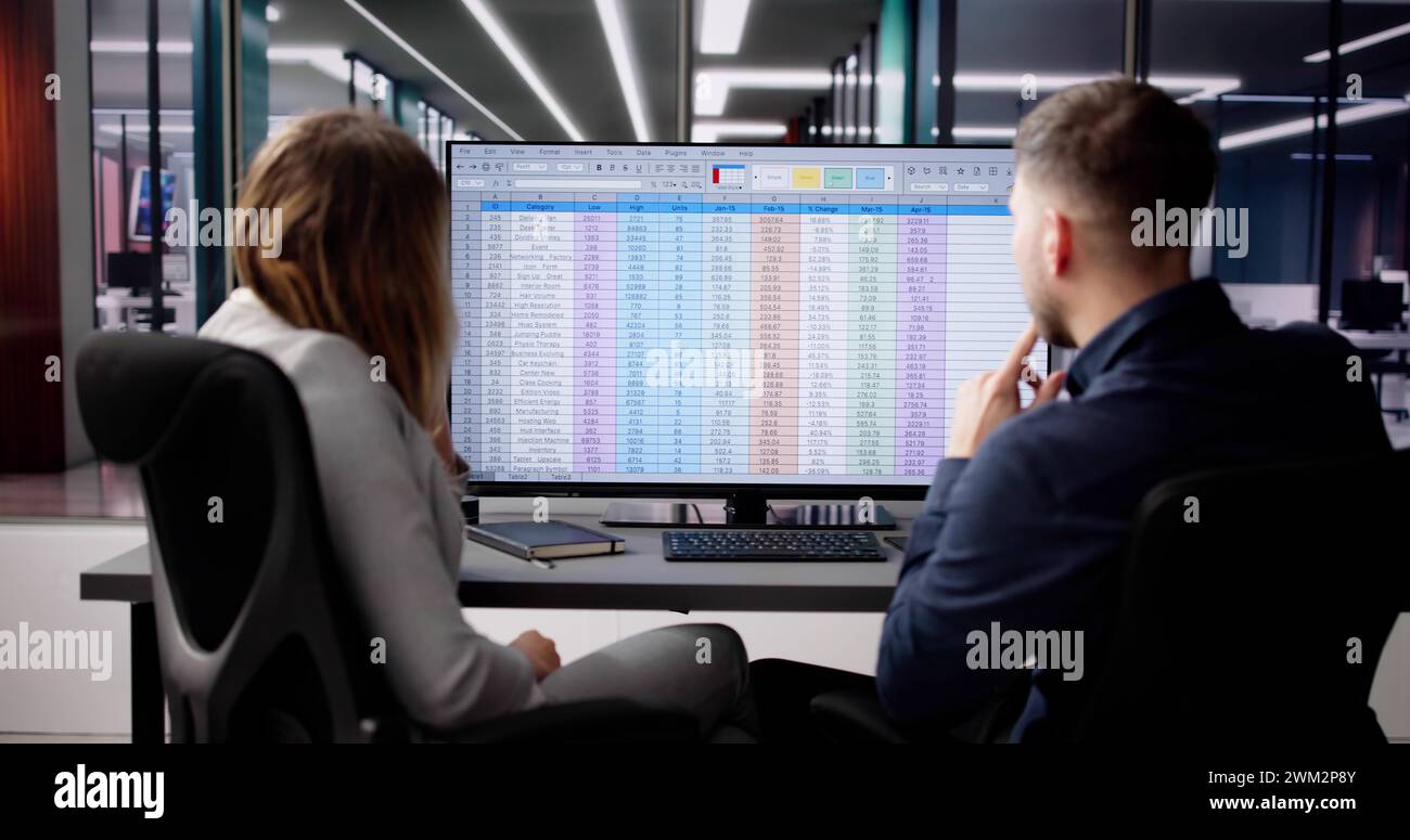 Analyst Employee Working On Spreadsheet Using Desktop Computer Stock ...