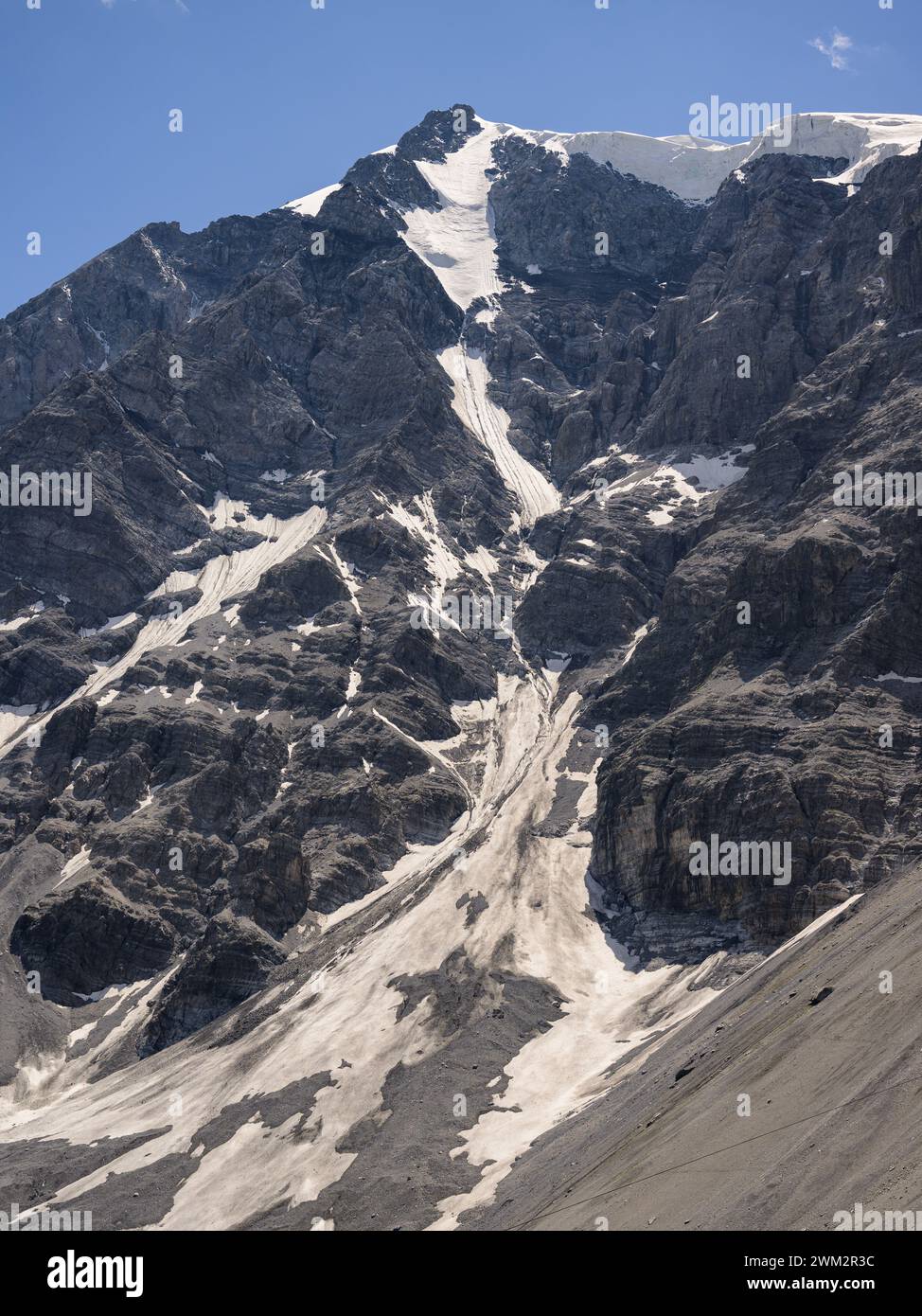 The Ortler Alps near Stelvo Pass on a sunny day in summer, blue sky ...