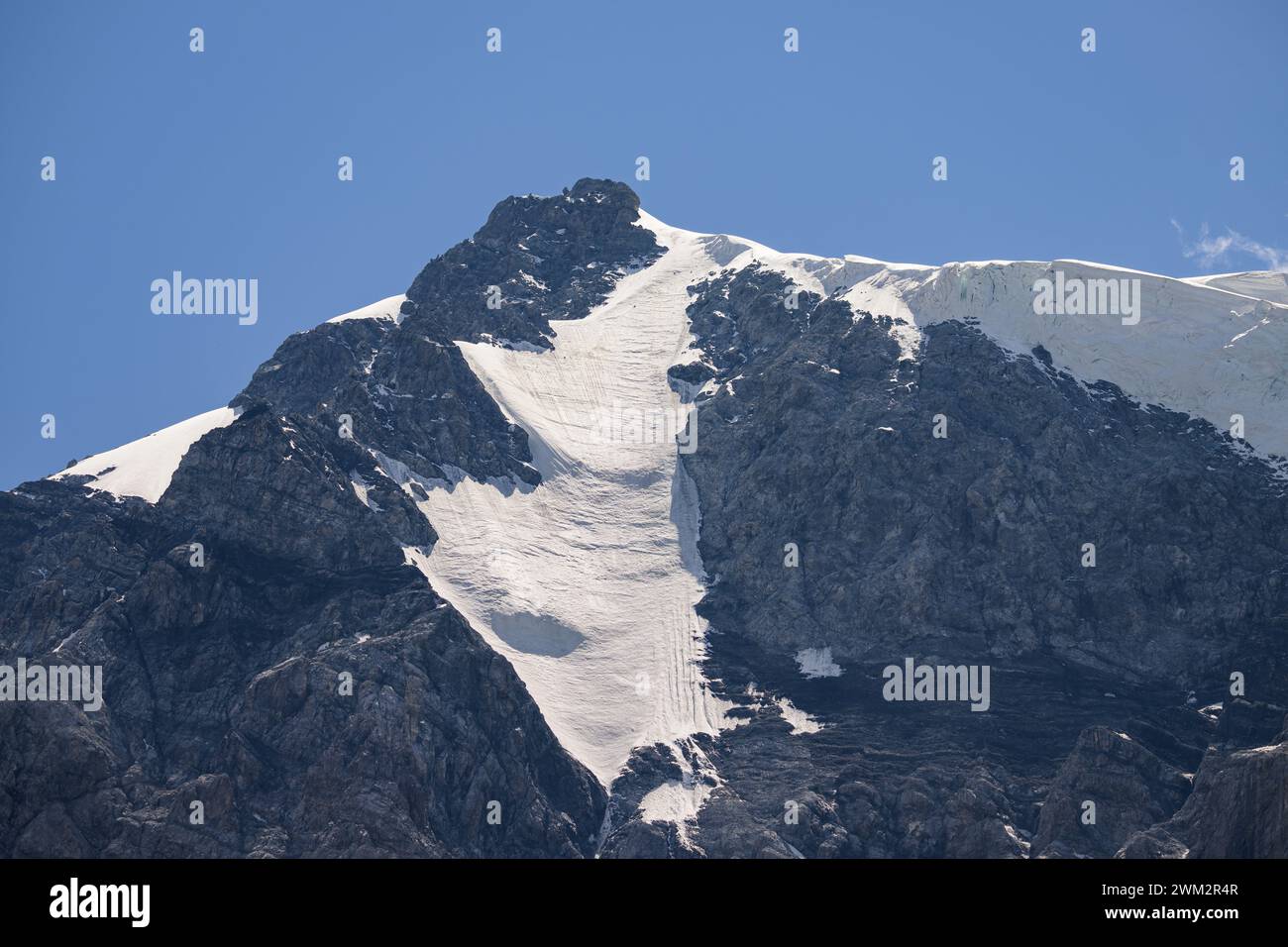 The Ortler Alps near Stelvo Pass on a sunny day in summer, blue sky ...