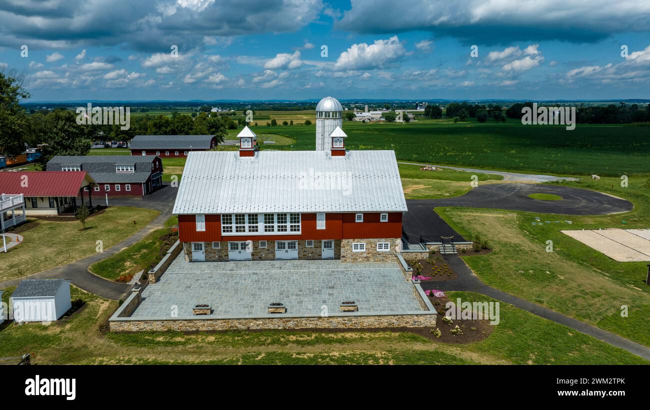 Overhead View Of A Large Red And Gray Barn With A Shiny Metal Roof ...